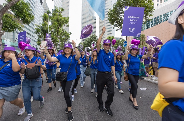 Singapore Pools Contingent: Marching in Purple for Inclusivity and ...