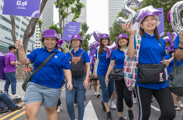 Singapore Pools Contingent: Marching in Purple for Inclusivity and ...
